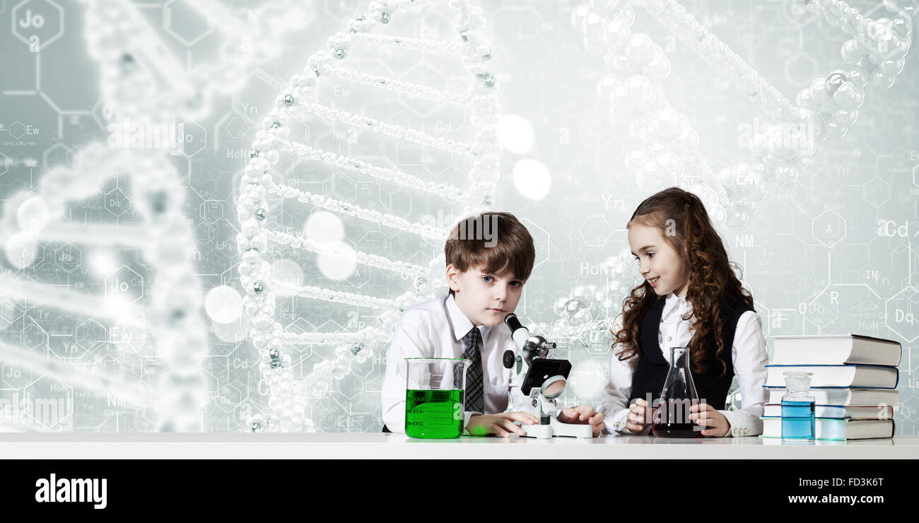 Cute girl and boy at chemistry lesson making tests Stock Photo - Alamy