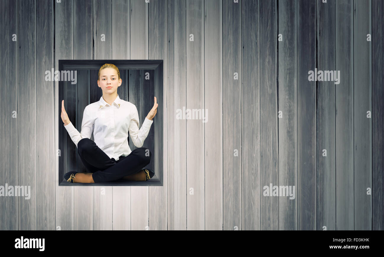 Young woman trapped in wooden cube in wall Stock Photo - Alamy