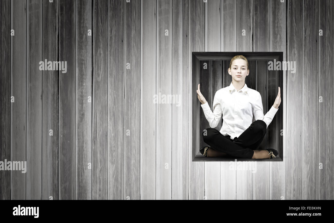 Young woman trapped in wooden cube in wall Stock Photo - Alamy