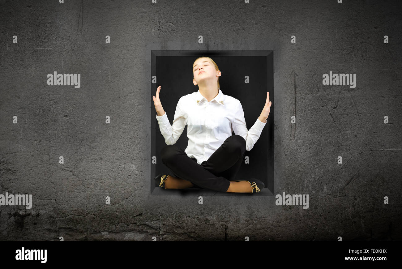 Young woman trapped in stone cube in wall Stock Photo - Alamy
