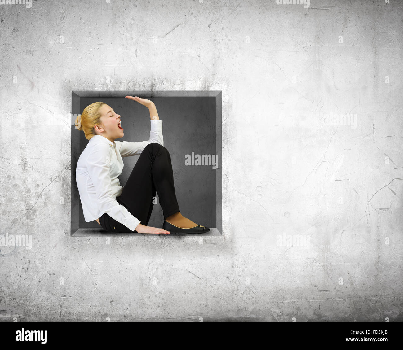 Young woman trapped in stone cube in wall Stock Photo - Alamy