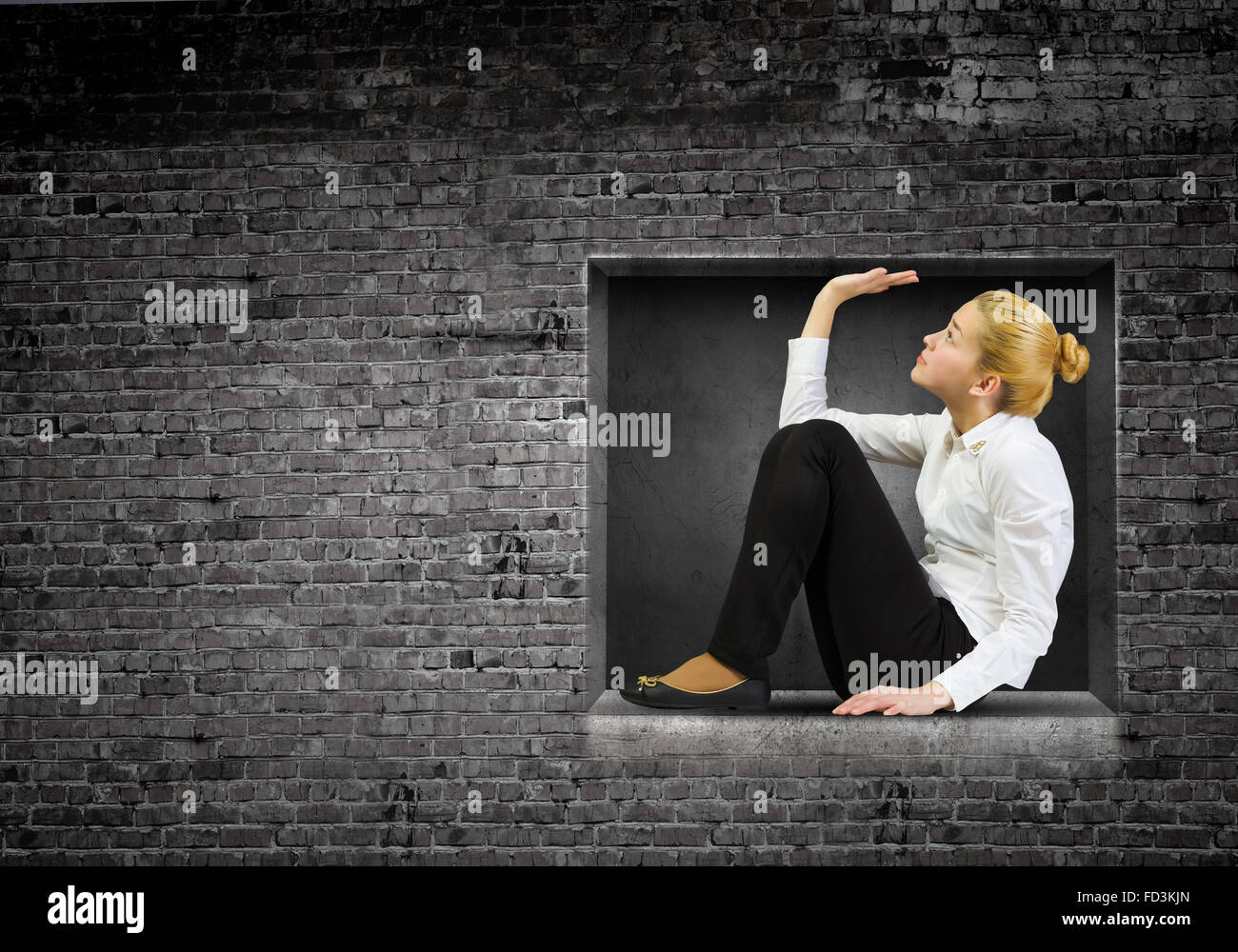 Young woman trapped in stone cube in wall Stock Photo - Alamy