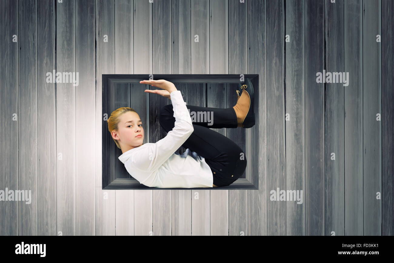 Young woman trapped in wooden cube in wall Stock Photo - Alamy