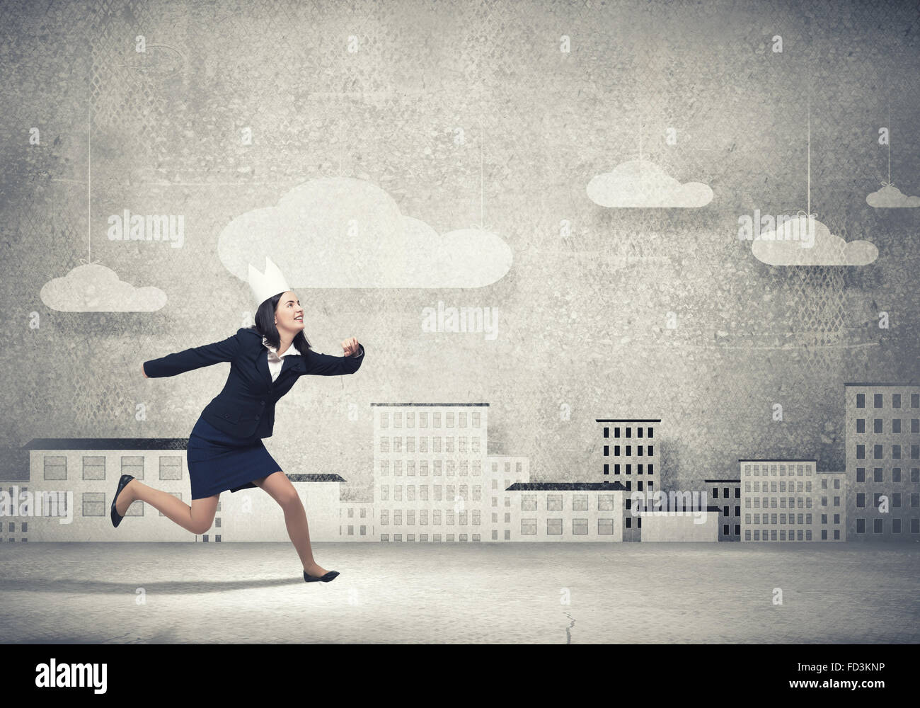 Young businesswoman in paper crown running in a hurry Stock Photo - Alamy