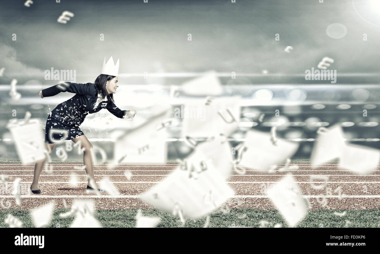 Young businesswoman in paper crown running in a hurry Stock Photo - Alamy
