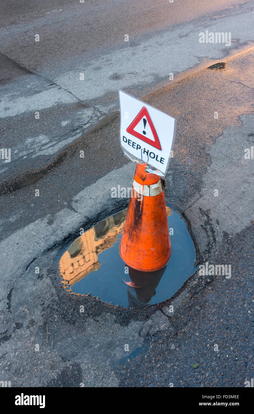 Warning sign on a traffic cone in New York City Stock Photo - Alamy