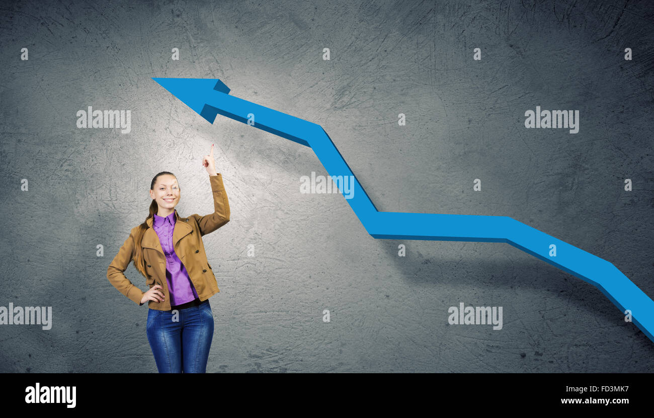 Young pretty woman pointing at increasing graph Stock Photo - Alamy