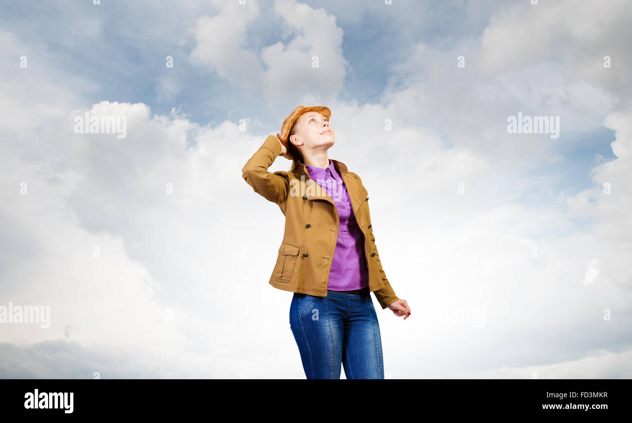 Young pretty woman in casual looking upwards Stock Photo - Alamy