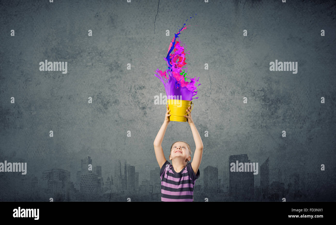 Cute girl with bucket and colorful springs coming out Stock Photo - Alamy
