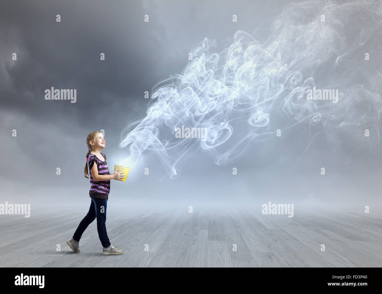 Cute girl with bucket and colorful springs coming out Stock Photo - Alamy