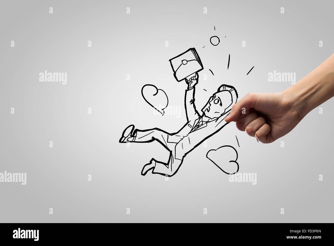 Close up of human hand catching businessman Stock Photo - Alamy