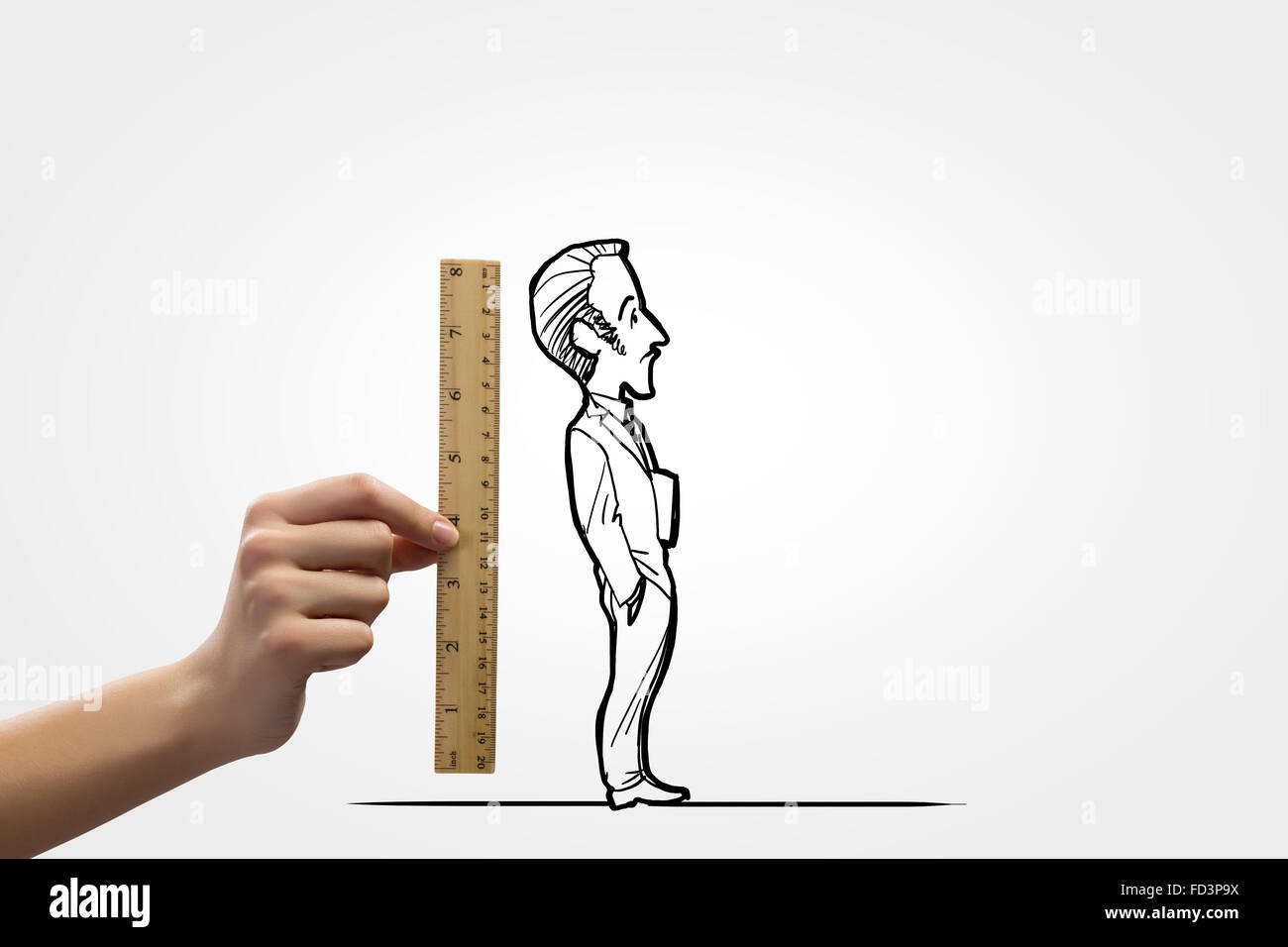 Human hand measuring caricature of businessman with ruler Stock Photo ...