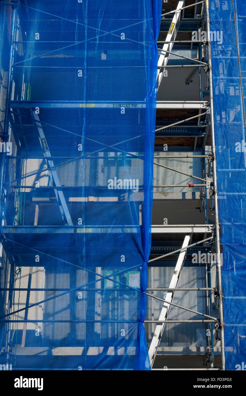 Staggered ladders at a building construction site Stock Photo - Alamy