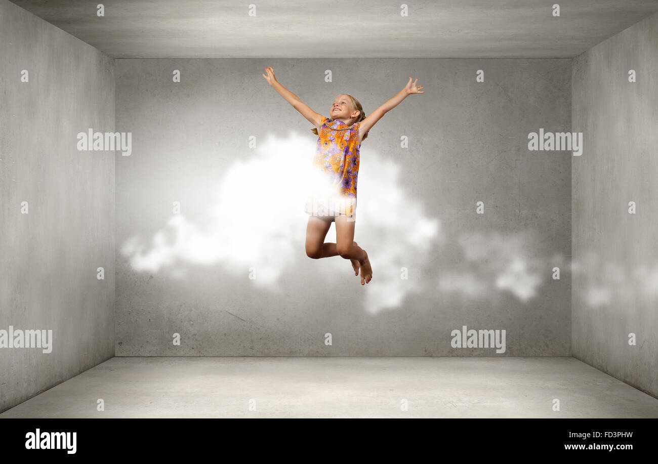 Little cute girl jumping high and flying in sky Stock Photo - Alamy