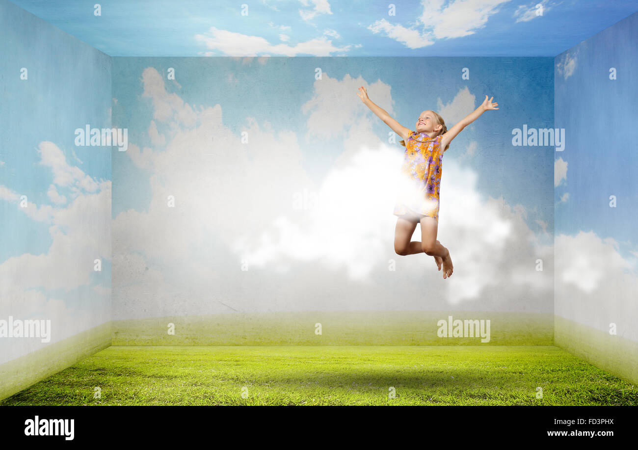 Little cute girl jumping high and flying in sky Stock Photo - Alamy