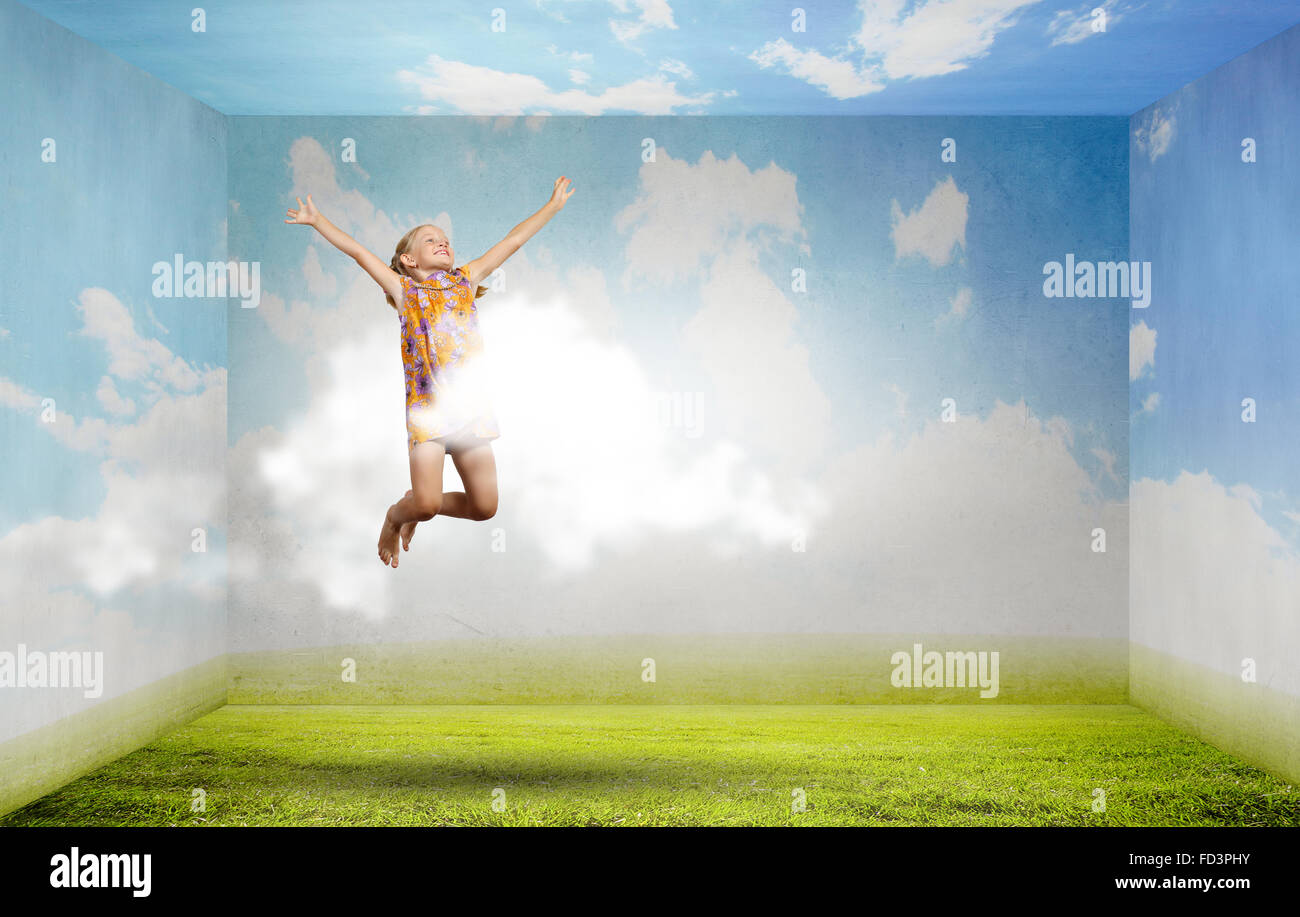 Little cute girl jumping high and flying in sky Stock Photo - Alamy