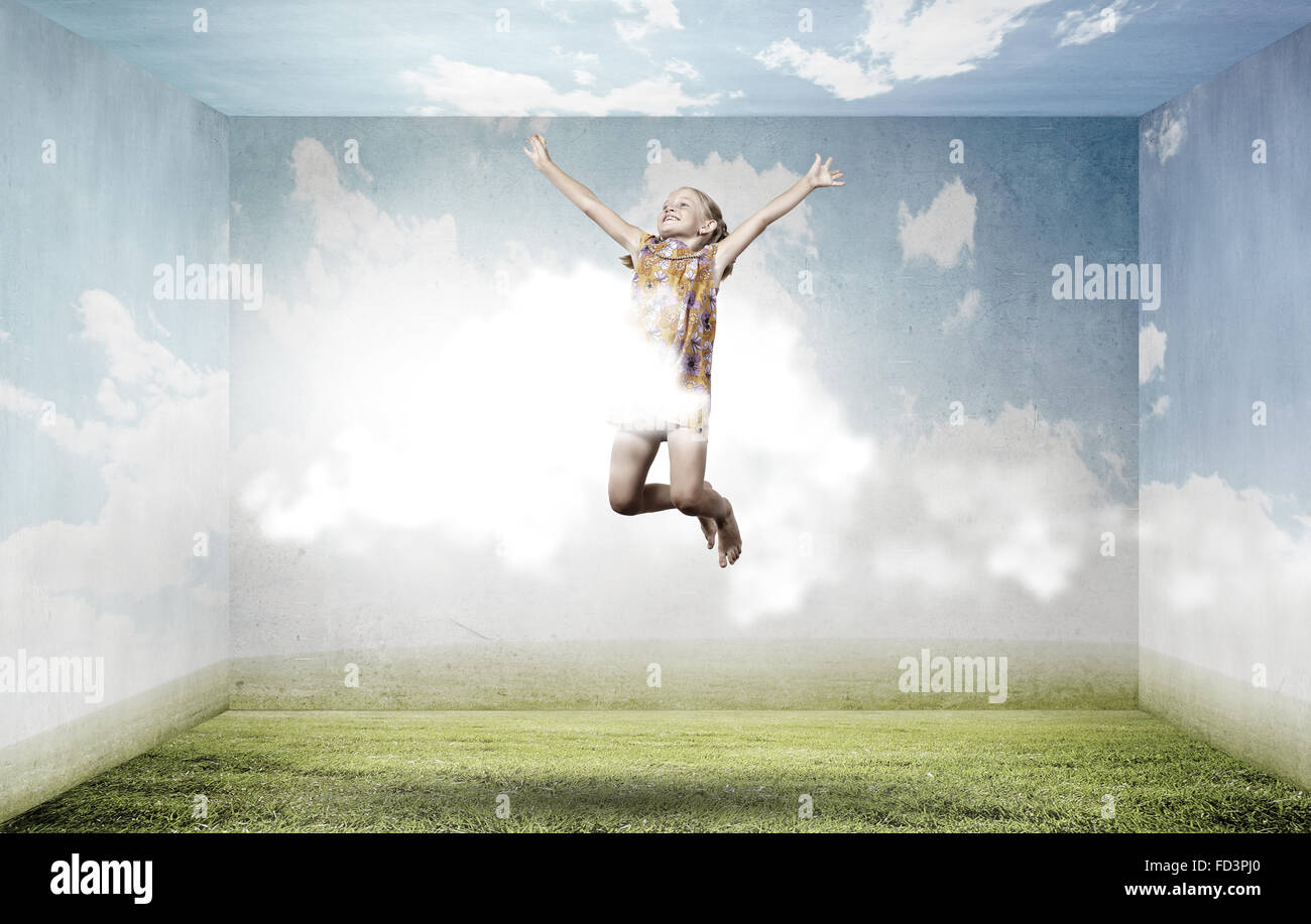 Little cute girl jumping high and flying in sky Stock Photo - Alamy