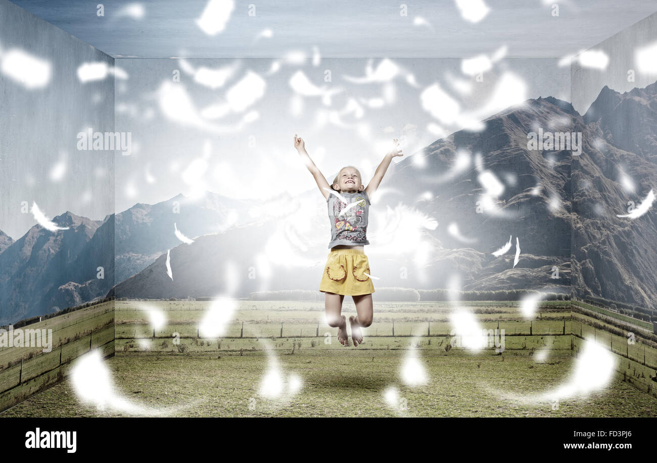 Little cute girl jumping high and flying in sky Stock Photo - Alamy