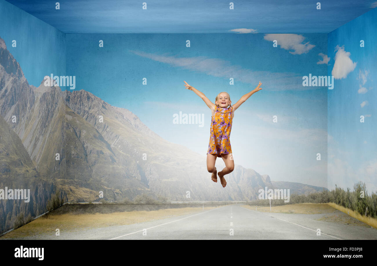 Little cute girl jumping high and flying in sky Stock Photo - Alamy