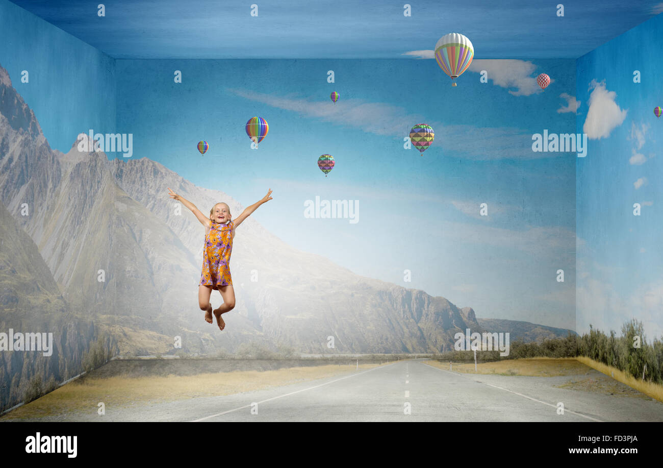Little cute girl jumping high and flying in sky Stock Photo - Alamy