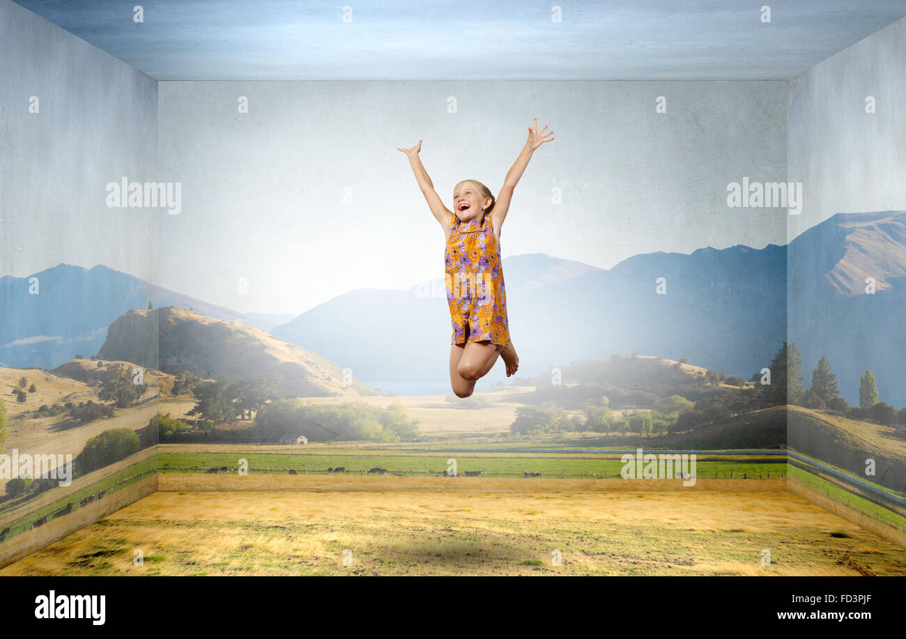 Little cute girl jumping high and flying in sky Stock Photo - Alamy