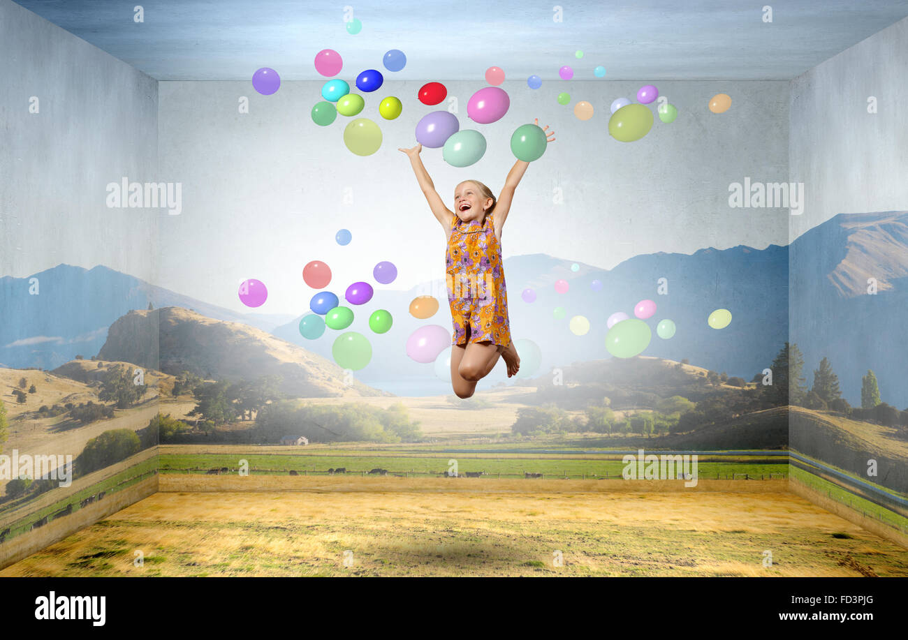 Little cute girl jumping high and flying in sky Stock Photo - Alamy