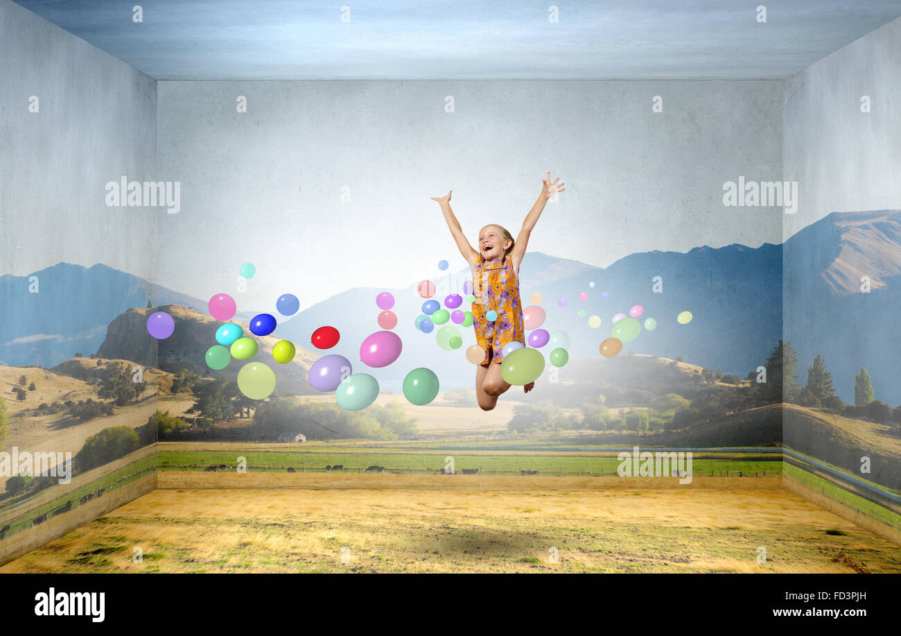 Little cute girl jumping high and flying in sky Stock Photo - Alamy