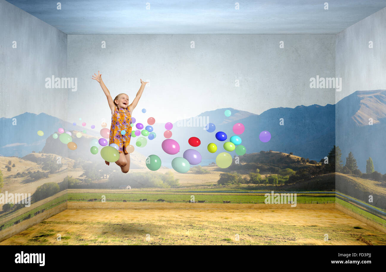 Little cute girl jumping high and flying in sky Stock Photo - Alamy