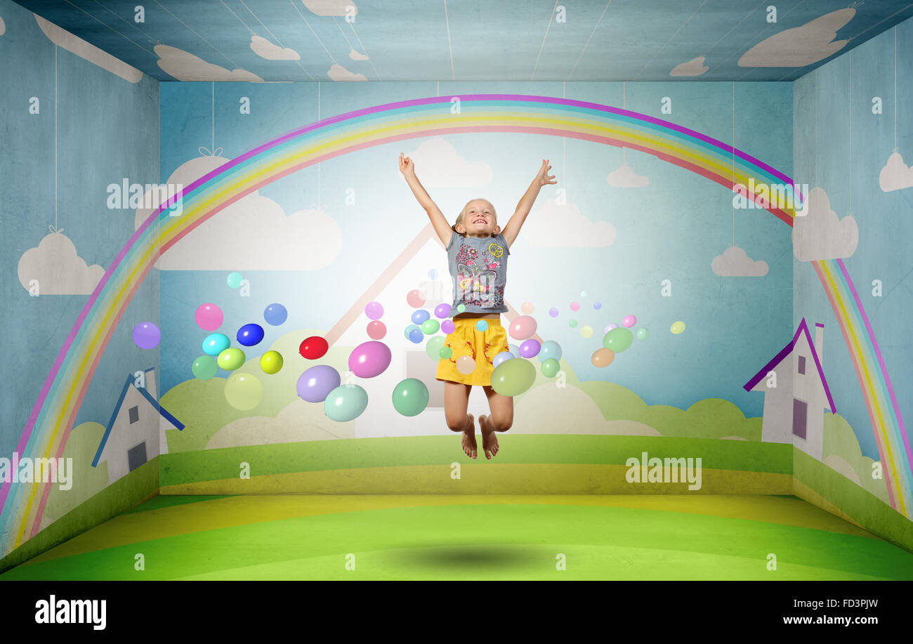 Little cute girl jumping high and flying in sky Stock Photo - Alamy