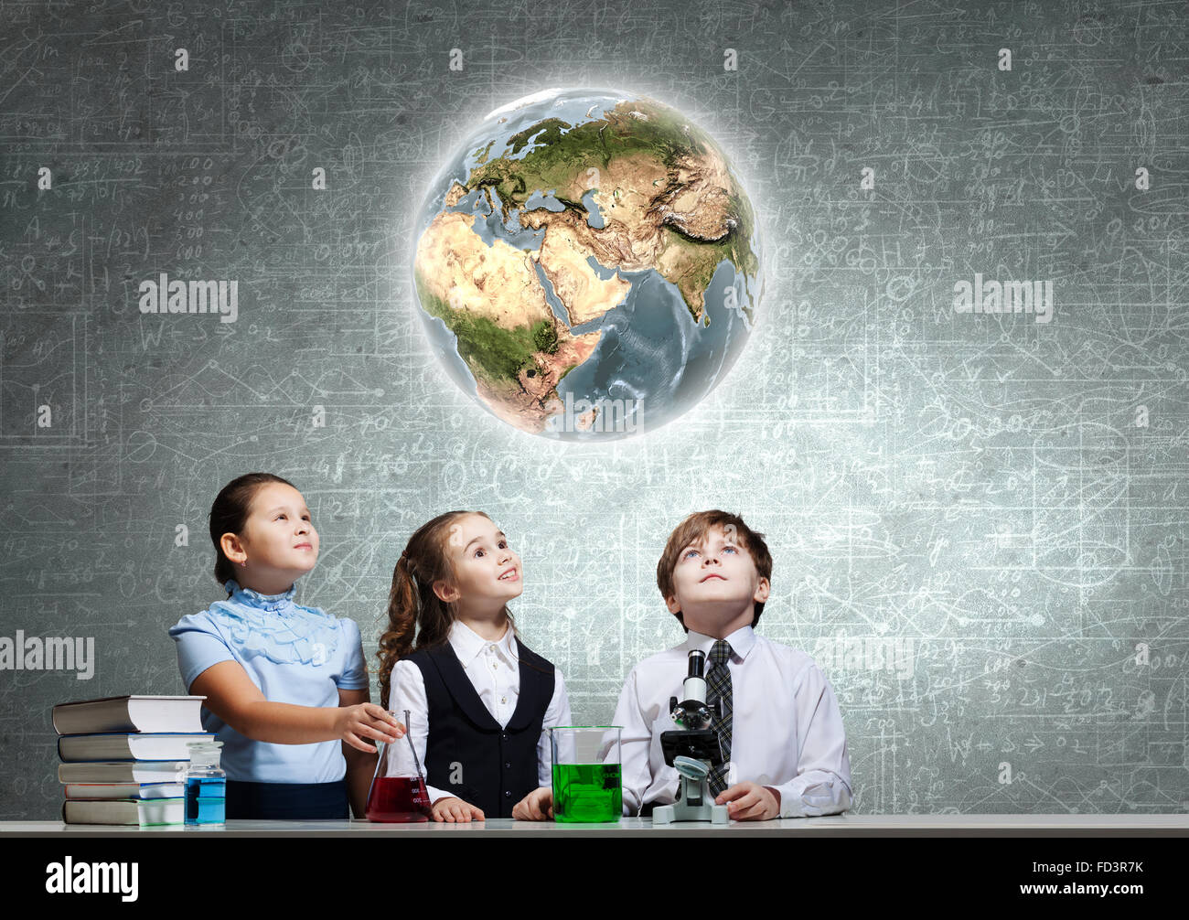 Three cute children at chemistry lesson making experiments. Elements of ...