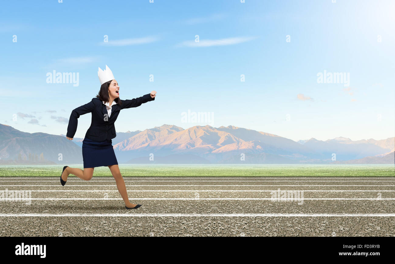 Young businesswoman in paper crown running in a hurry Stock Photo - Alamy