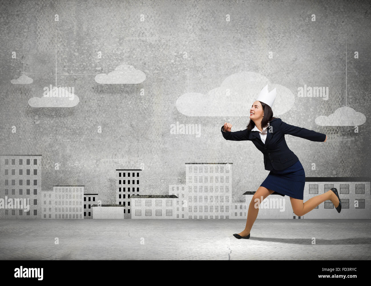 Young businesswoman in paper crown running in a hurry Stock Photo - Alamy