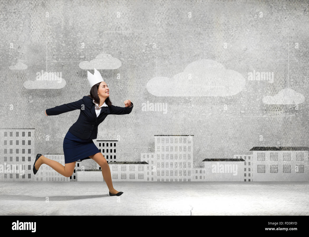 Young businesswoman in paper crown running in a hurry Stock Photo - Alamy