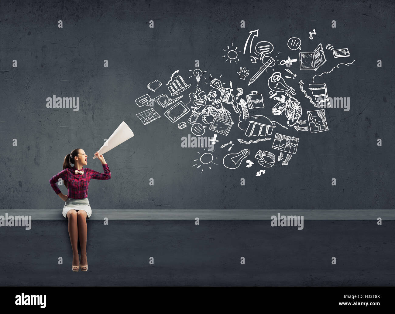 Young pretty woman screaming in paper trumpet Stock Photo - Alamy