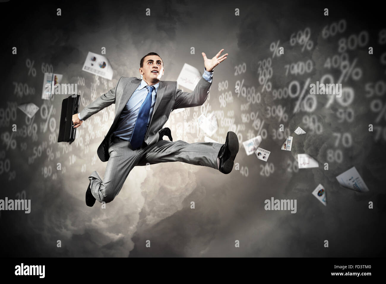Image of a businessman jumping high against financial background Stock ...