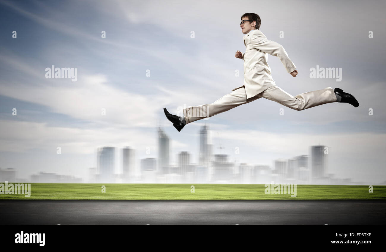 Man in suit running into distance hi-res stock photography and images ...