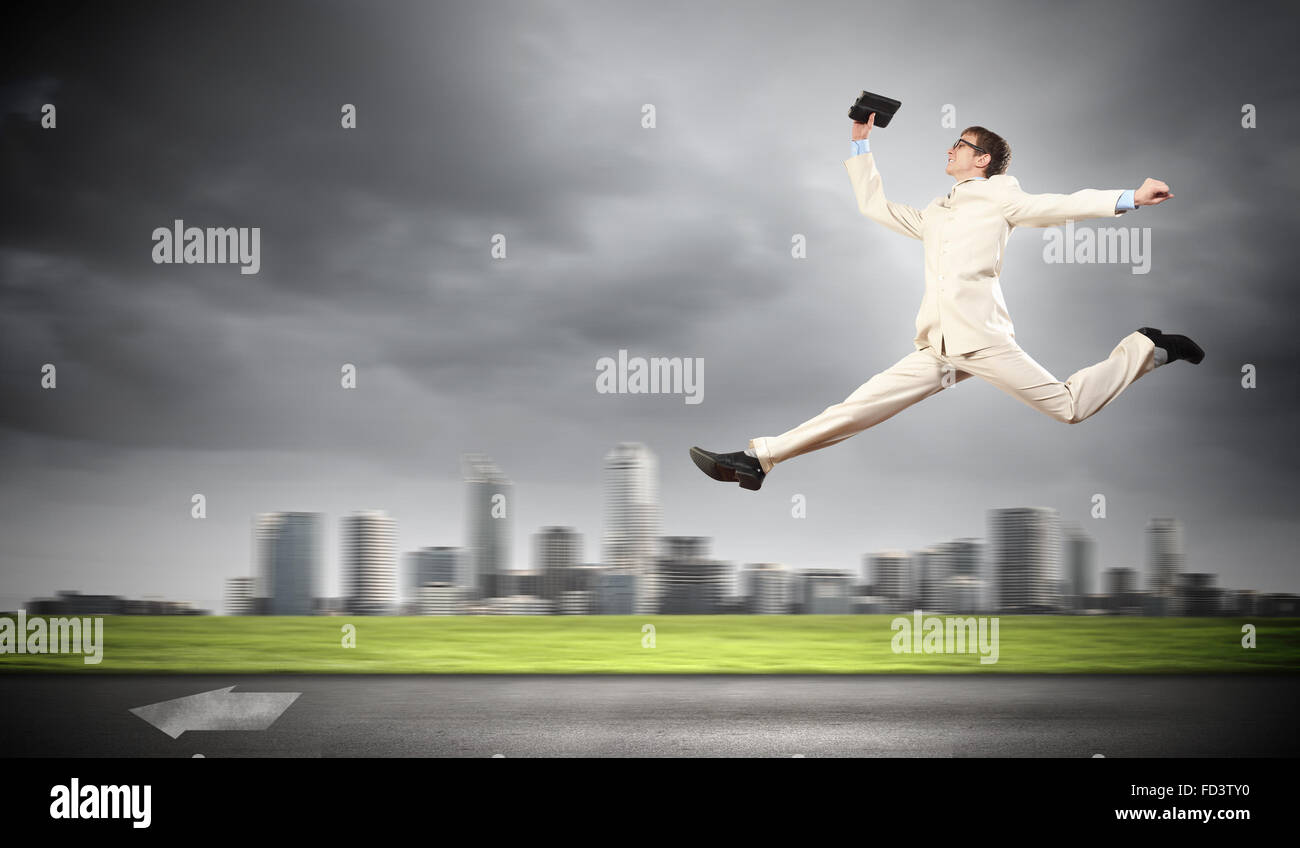 Man in suit running into distance hi-res stock photography and images ...