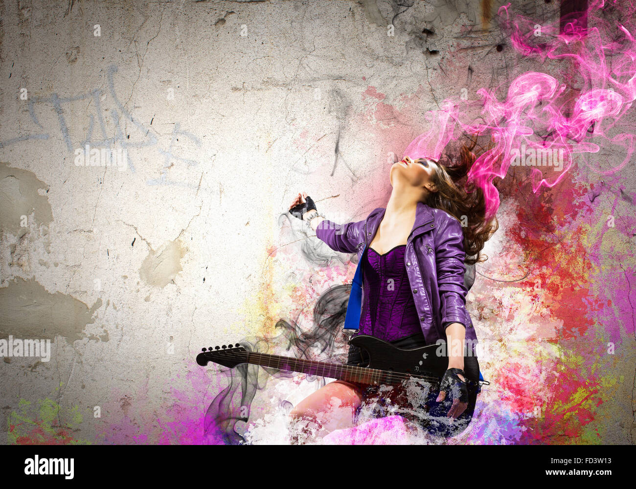 Young attractive rock girl playing the electric guitar Stock Photo - Alamy