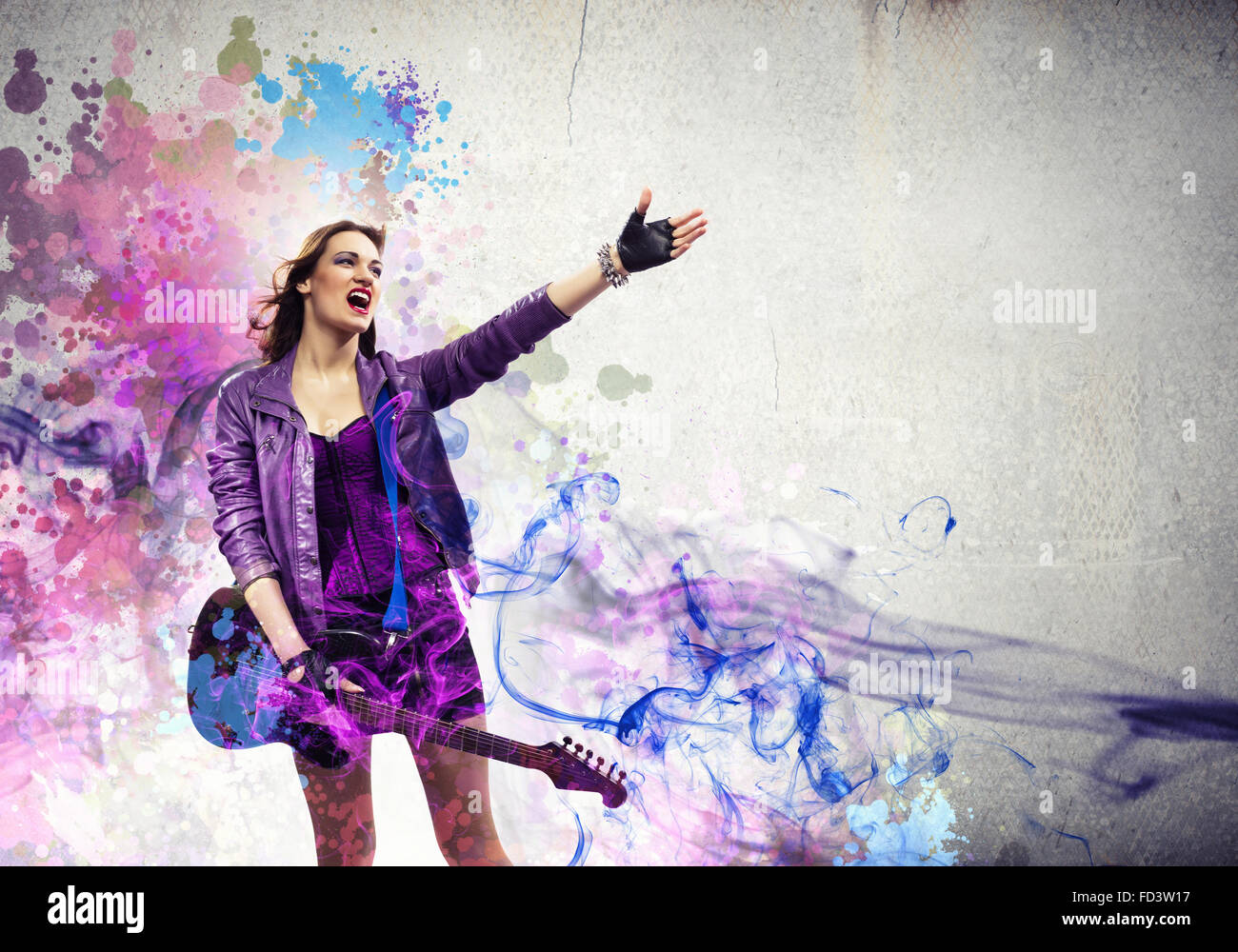 Young attractive rock girl playing the electric guitar Stock Photo - Alamy
