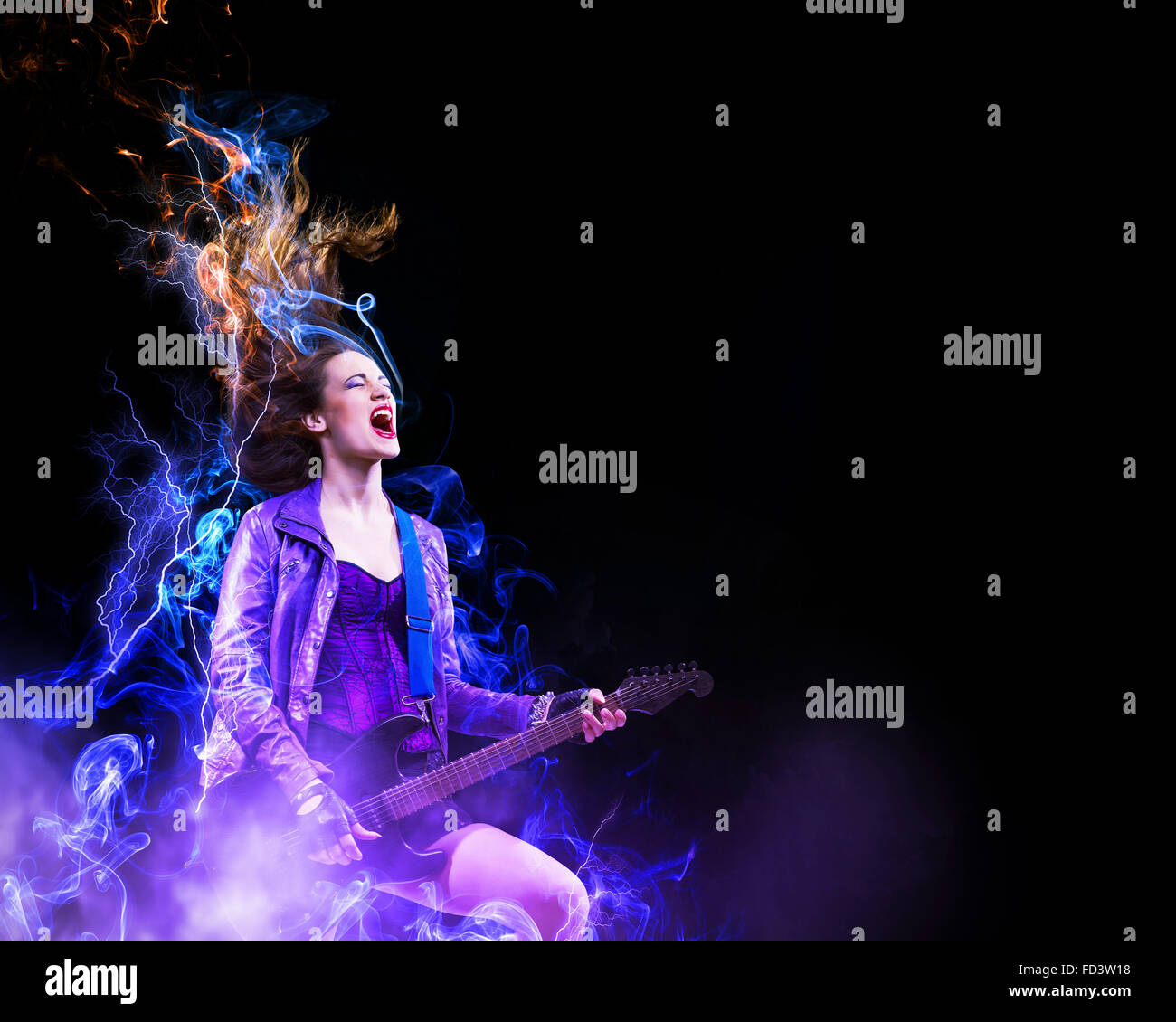 Young attractive rock girl playing the electric guitar Stock Photo - Alamy