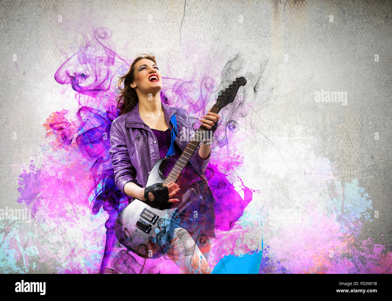 Young attractive rock girl playing the electric guitar Stock Photo - Alamy