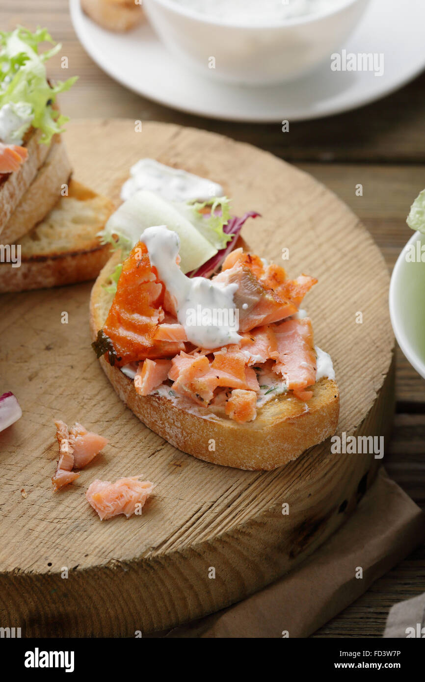 toasted bread with fish and sauce, rustic food Stock Photo - Alamy