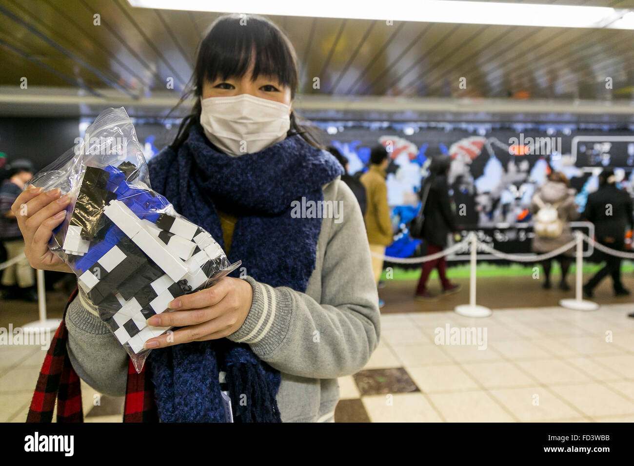 Dragon Quest fans collect blocks from a giant Lego wall mural on ...