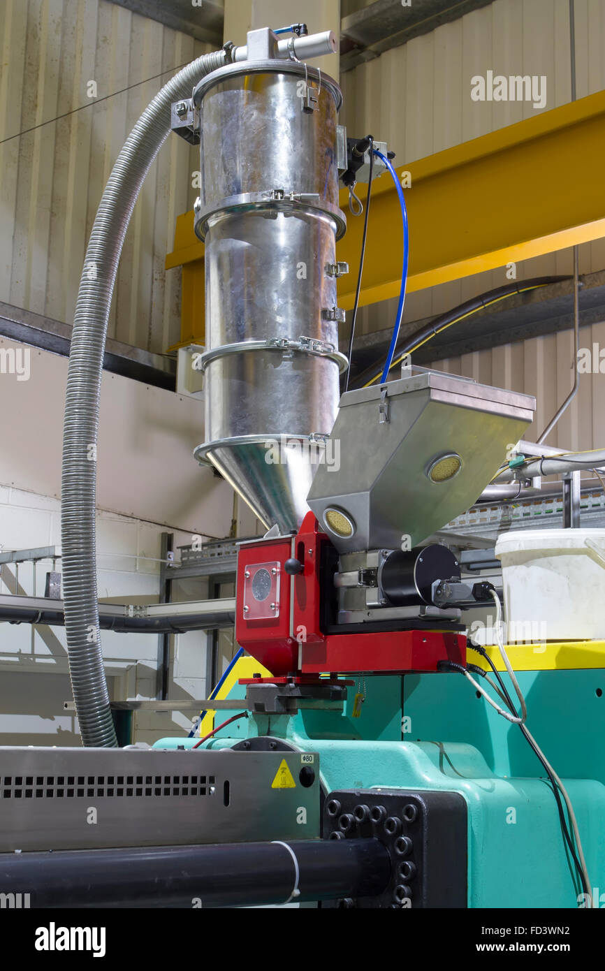 Injection moulding machine masterbatch mixing unit Stock Photo - Alamy
