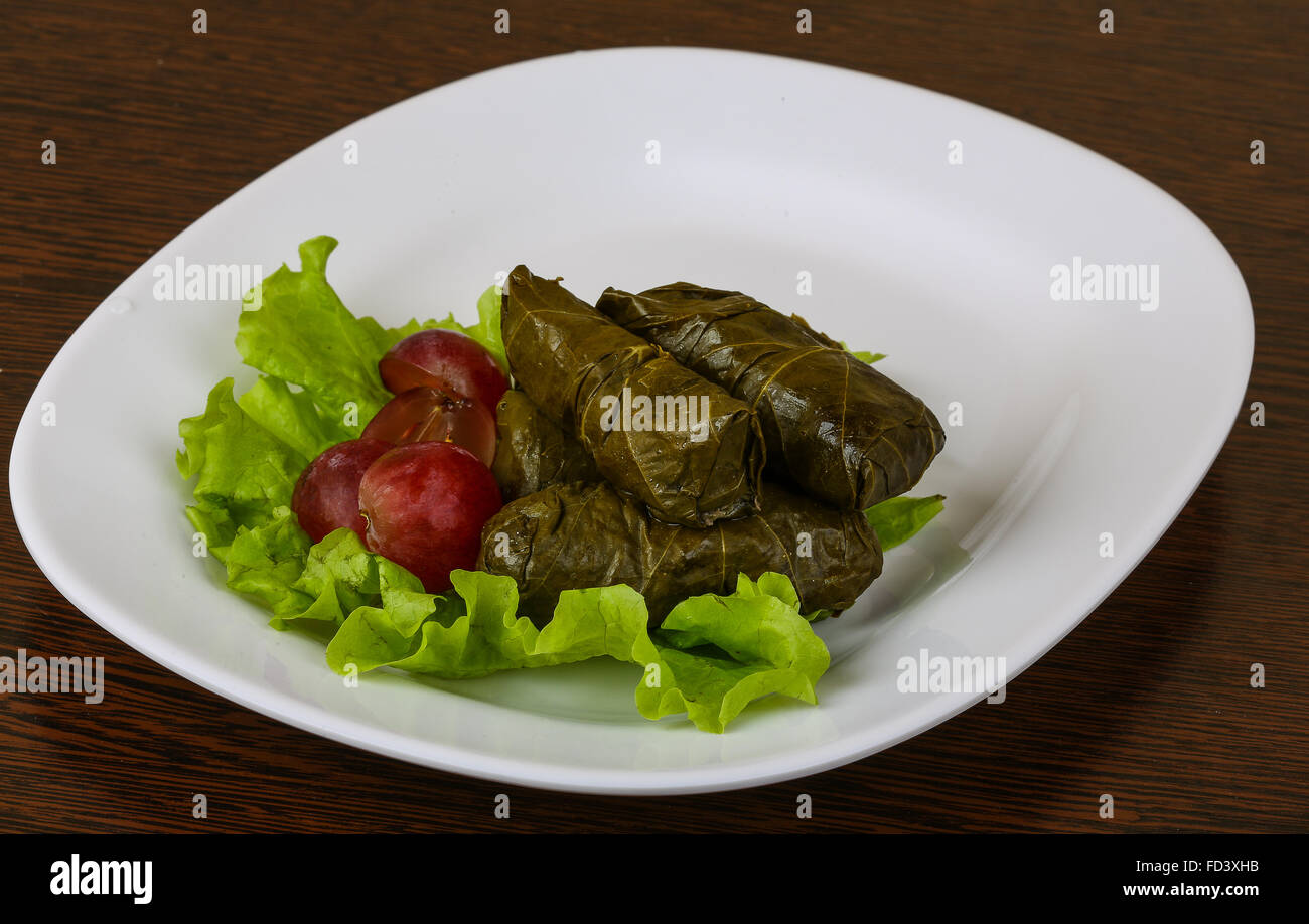 Dolma - minced meat in grape leaves with salad Stock Photo - Alamy