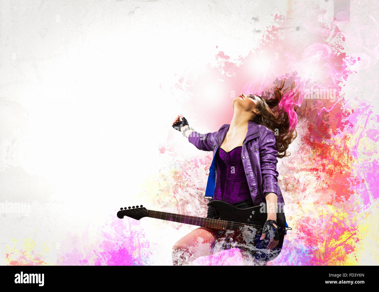 Young attractive rock girl playing the electric guitar Stock Photo - Alamy