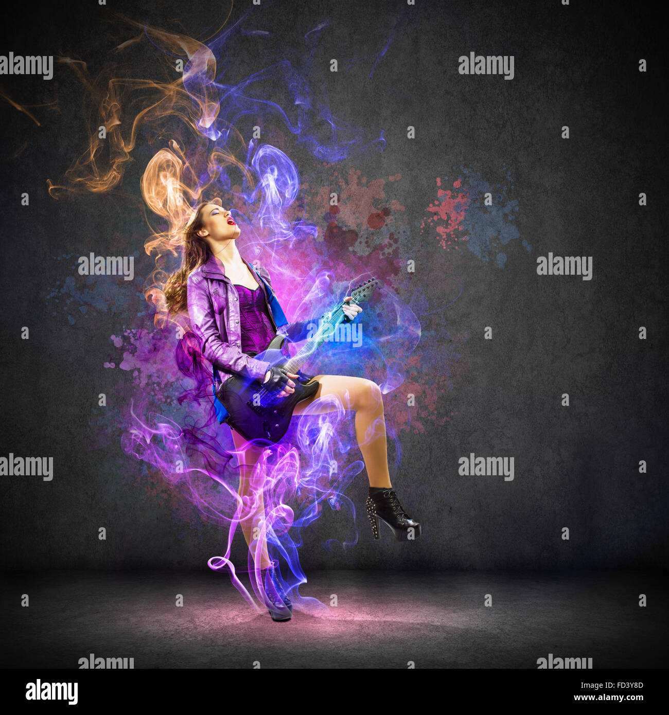 Young attractive rock girl playing the electric guitar Stock Photo - Alamy