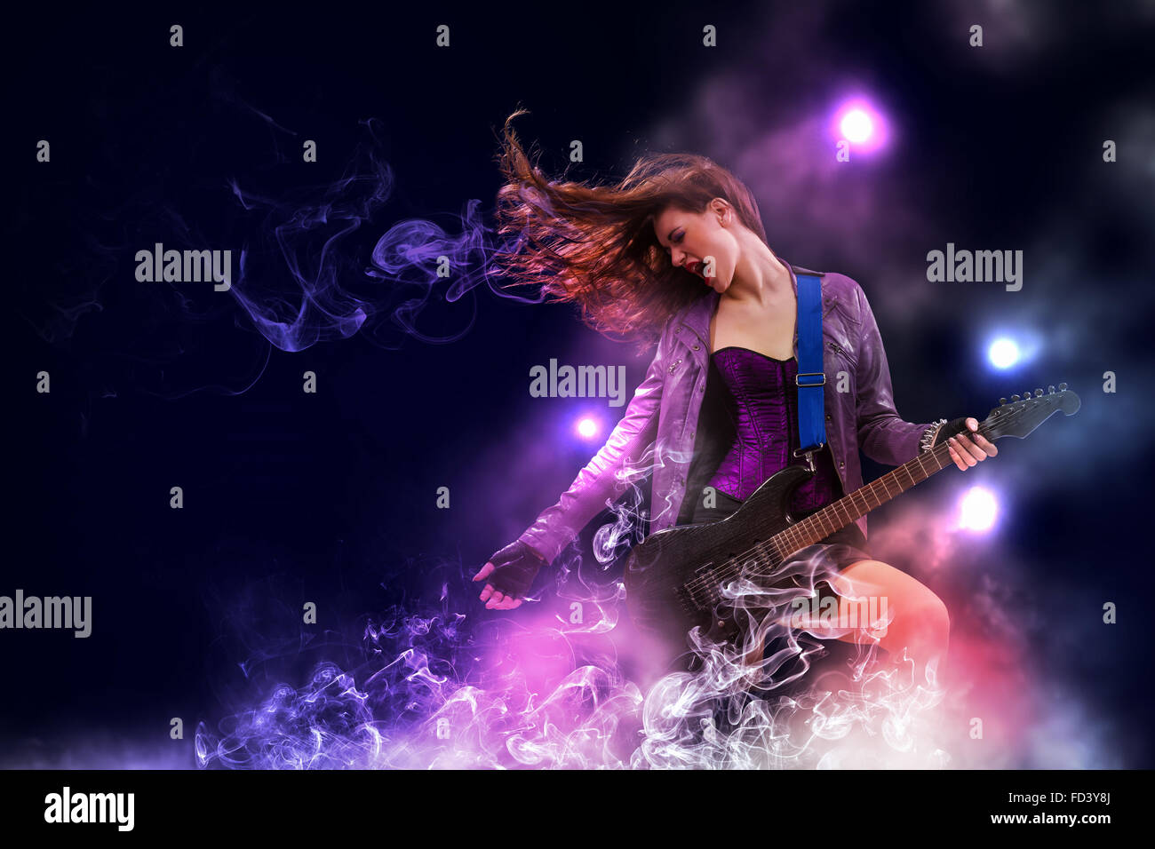 Young attractive rock girl playing the electric guitar Stock Photo - Alamy