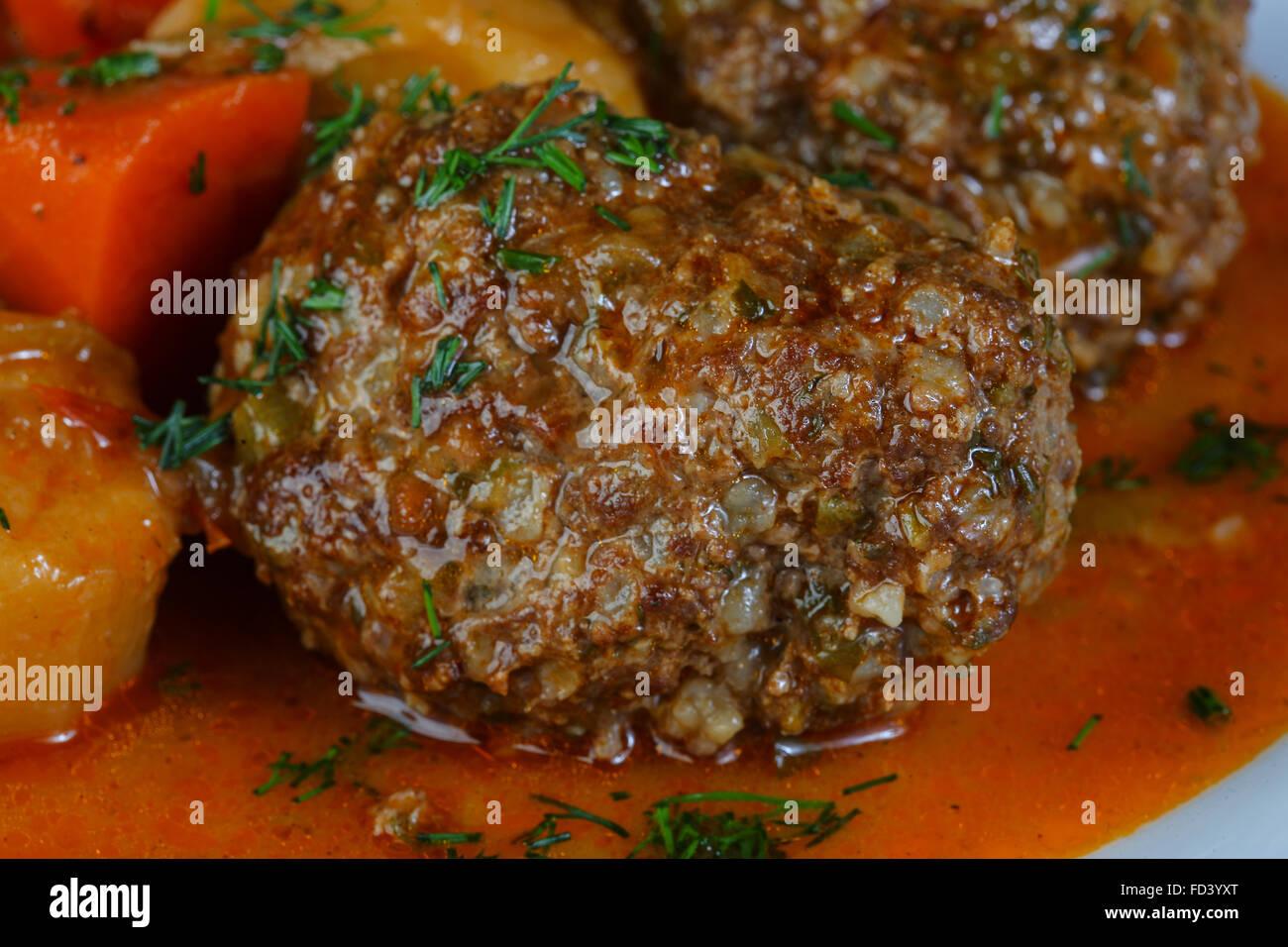 Minced meat balls with potato, carrots and sauce Stock Photo - Alamy