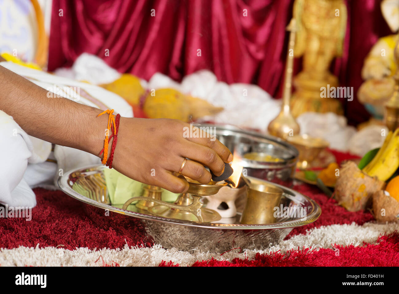 Traditional Indian Hindu religious praying items in ear piercing ...